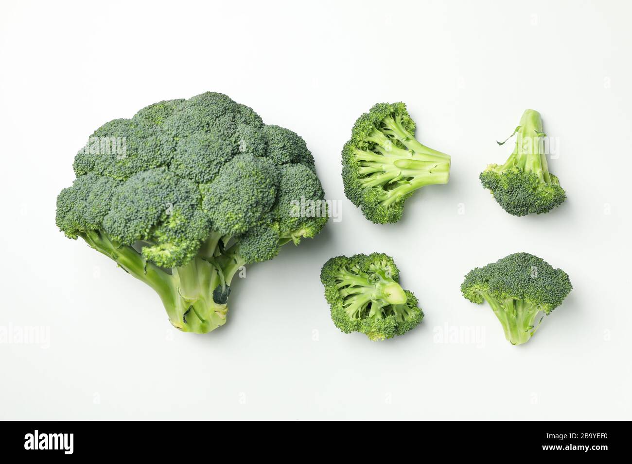 Flat lay with broccoli on white background, top view Stock Photo - Alamy