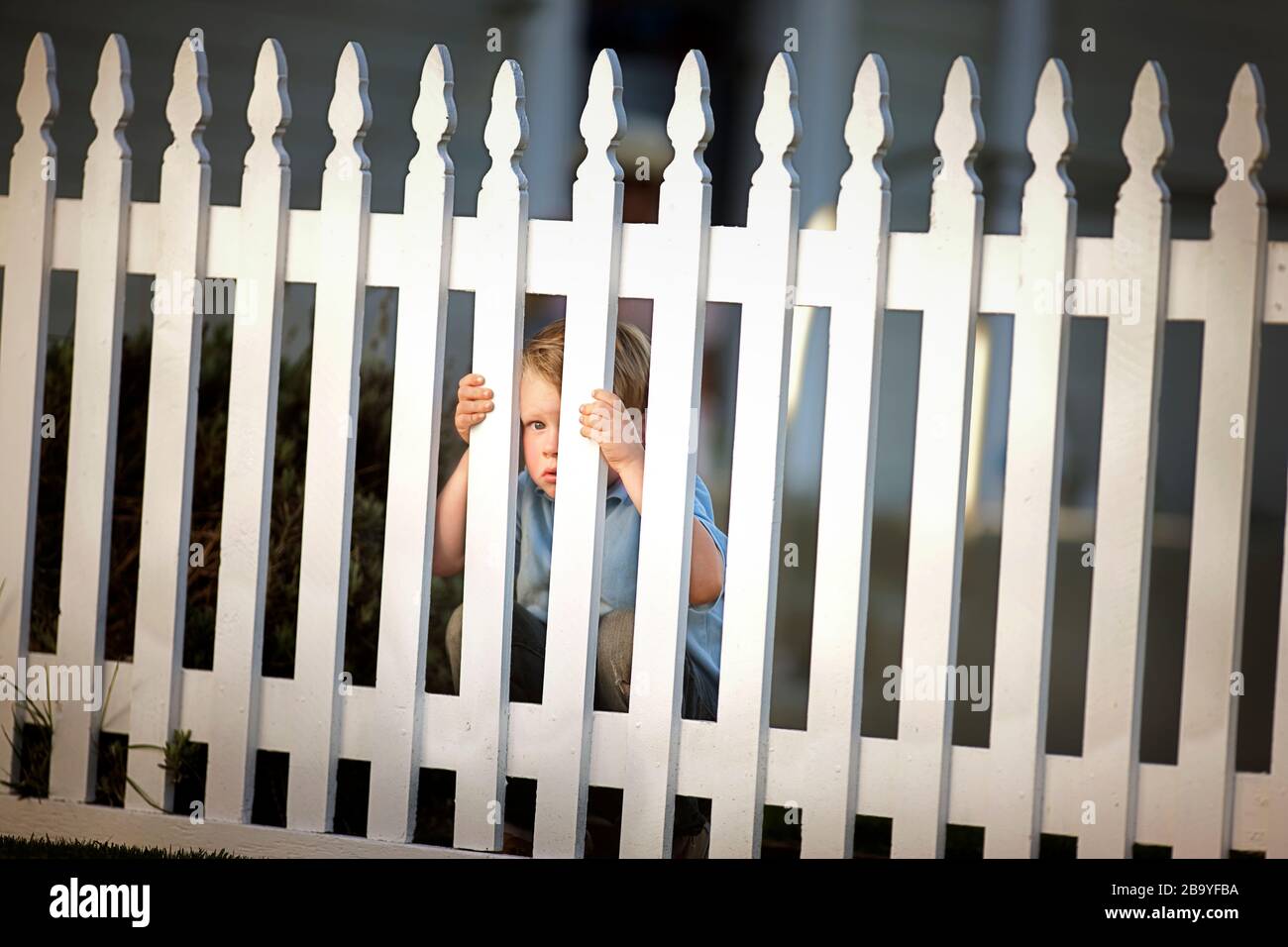 Baby Peeking Over Fence