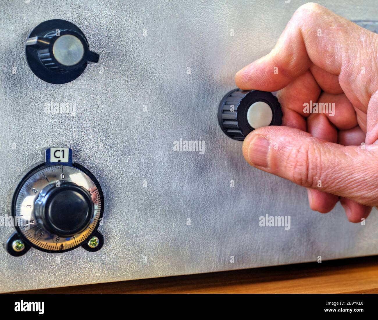 Radio amateur tuning the high frequency power amplifier close up view ...