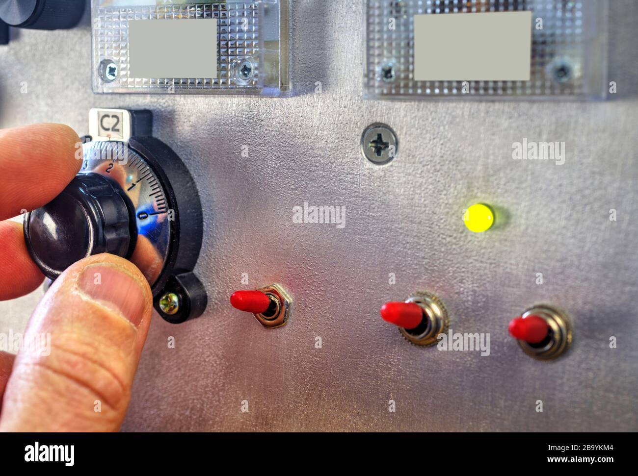 Radio amateur tuning the high frequency power amplifier close up view ...