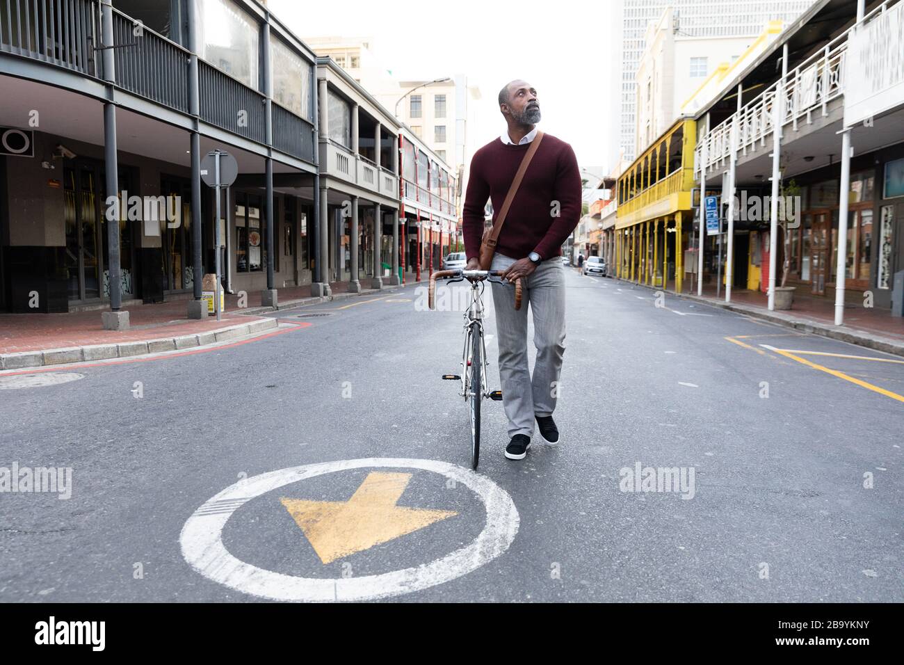 Man beside bike hi-res stock photography and images - Alamy