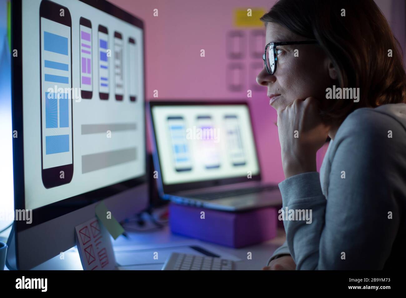 Designers create a user interface for mobile phones Stock Photo - Alamy