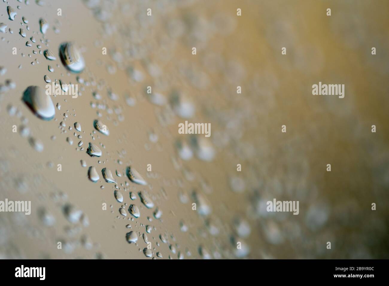 small single raindrops on a piece of glass Stock Photo - Alamy