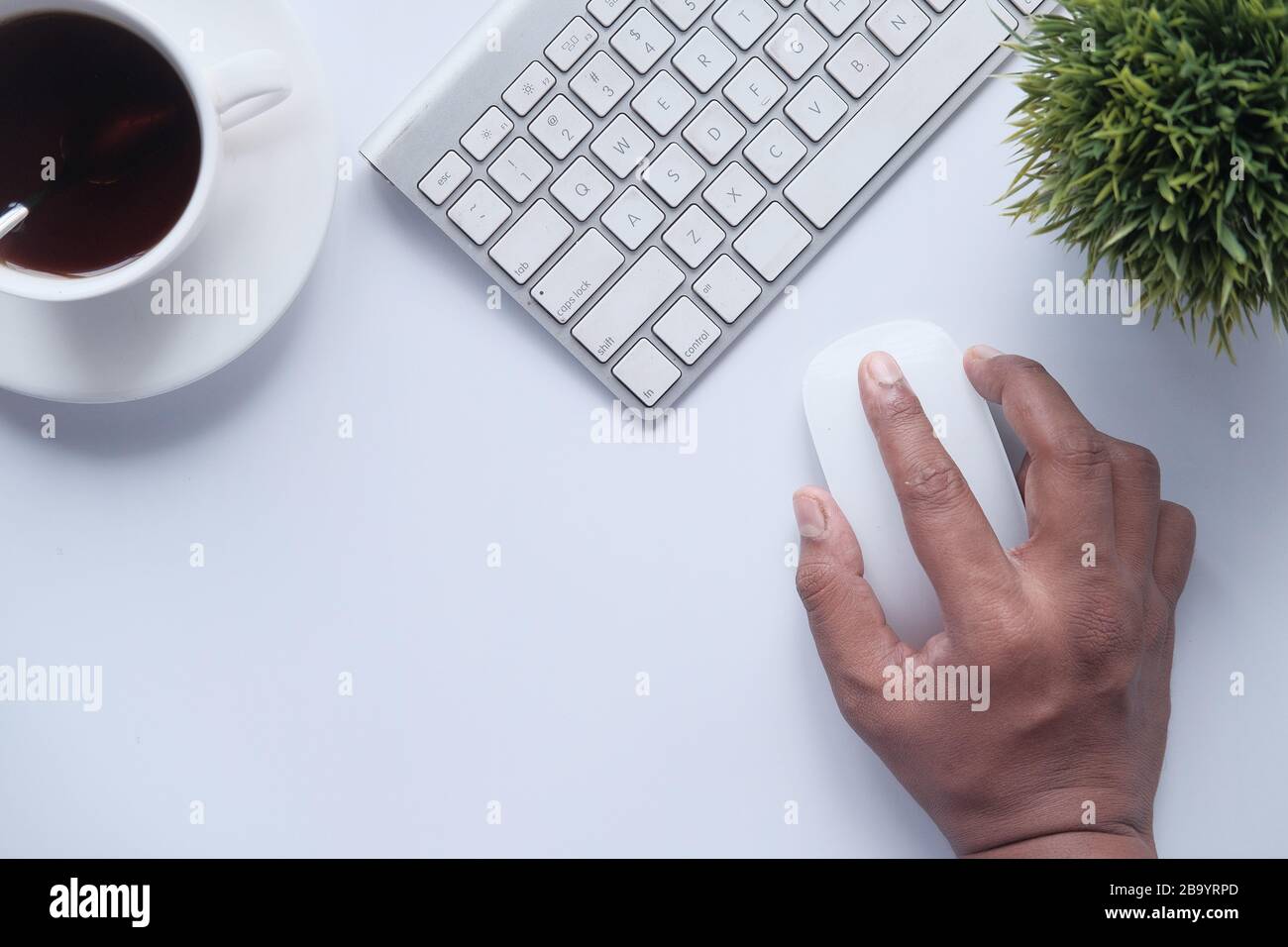 man hand use computer mouse on white background Stock Photo - Alamy