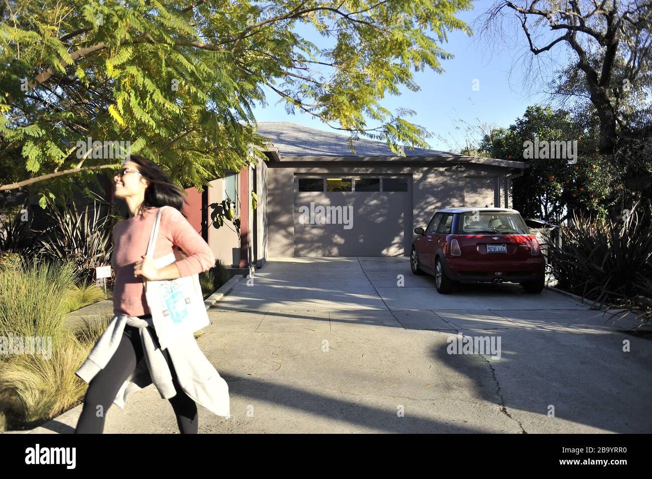 Woman Coming Out Front Door Hi Res Stock Photography And Images Alamy