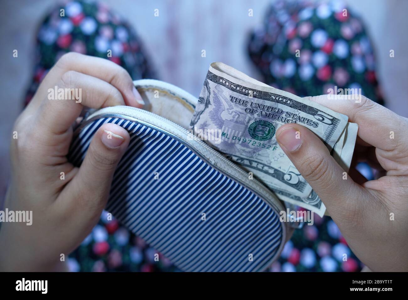 Woman taking banknote from hi-res stock photography and images - Alamy