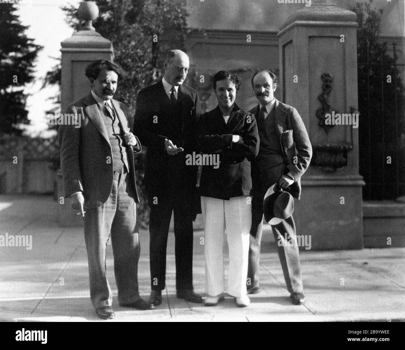 CHARLIE CHAPLIN on street set with Unidentified Guests circa 1928 ...