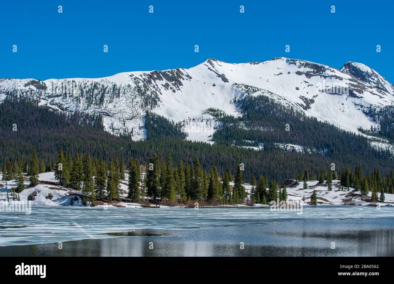Landscape of melting ice on Molas Lake and snow on the San Juan ...