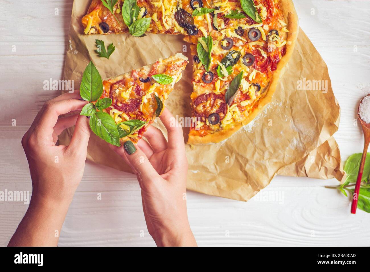 Hands taking slices of pizza. Hand holding slice pizza. Hand taking ...