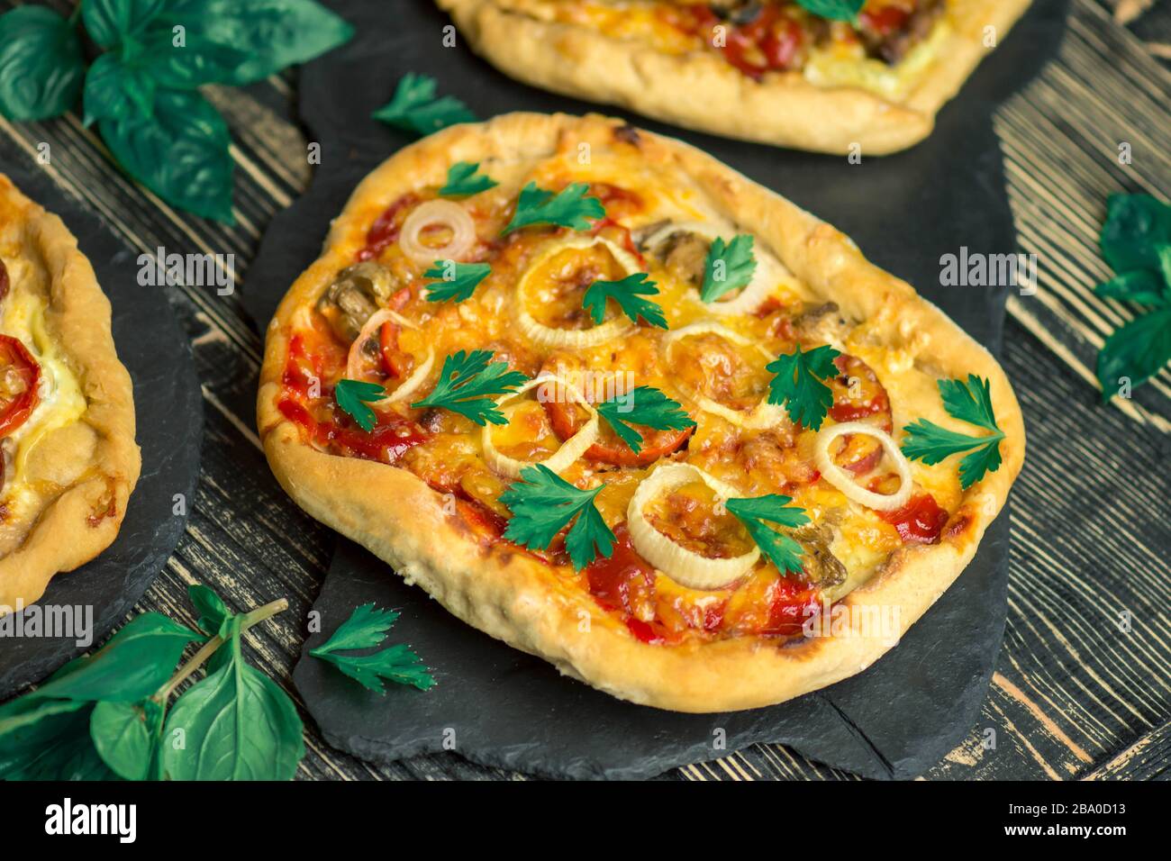 American pizza with mozzarella, tomato, pepperoni on dark wooden table ...