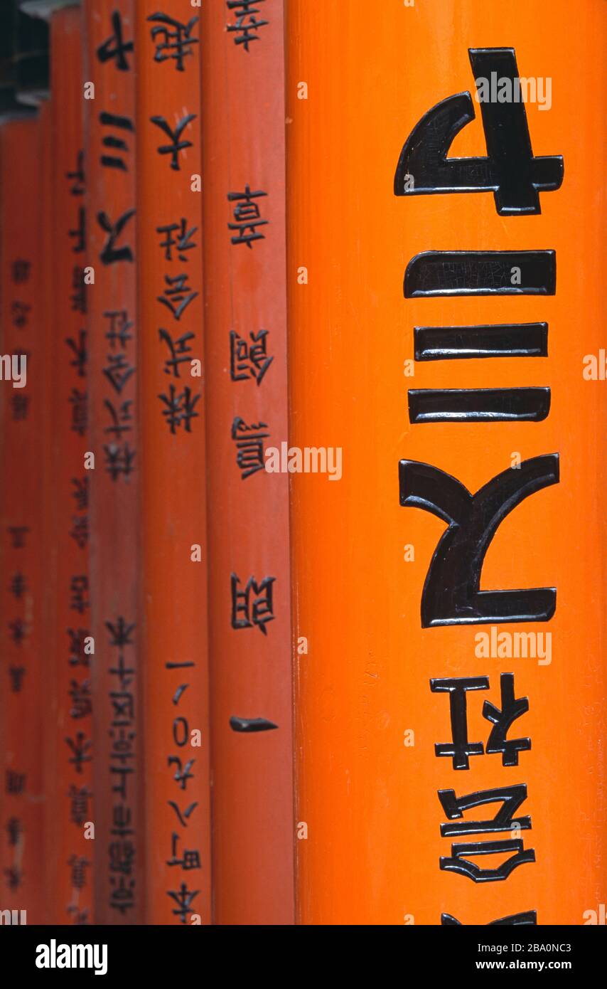 Close-up of Japanese script on torii gates at Fushimi Inari Shrine ...