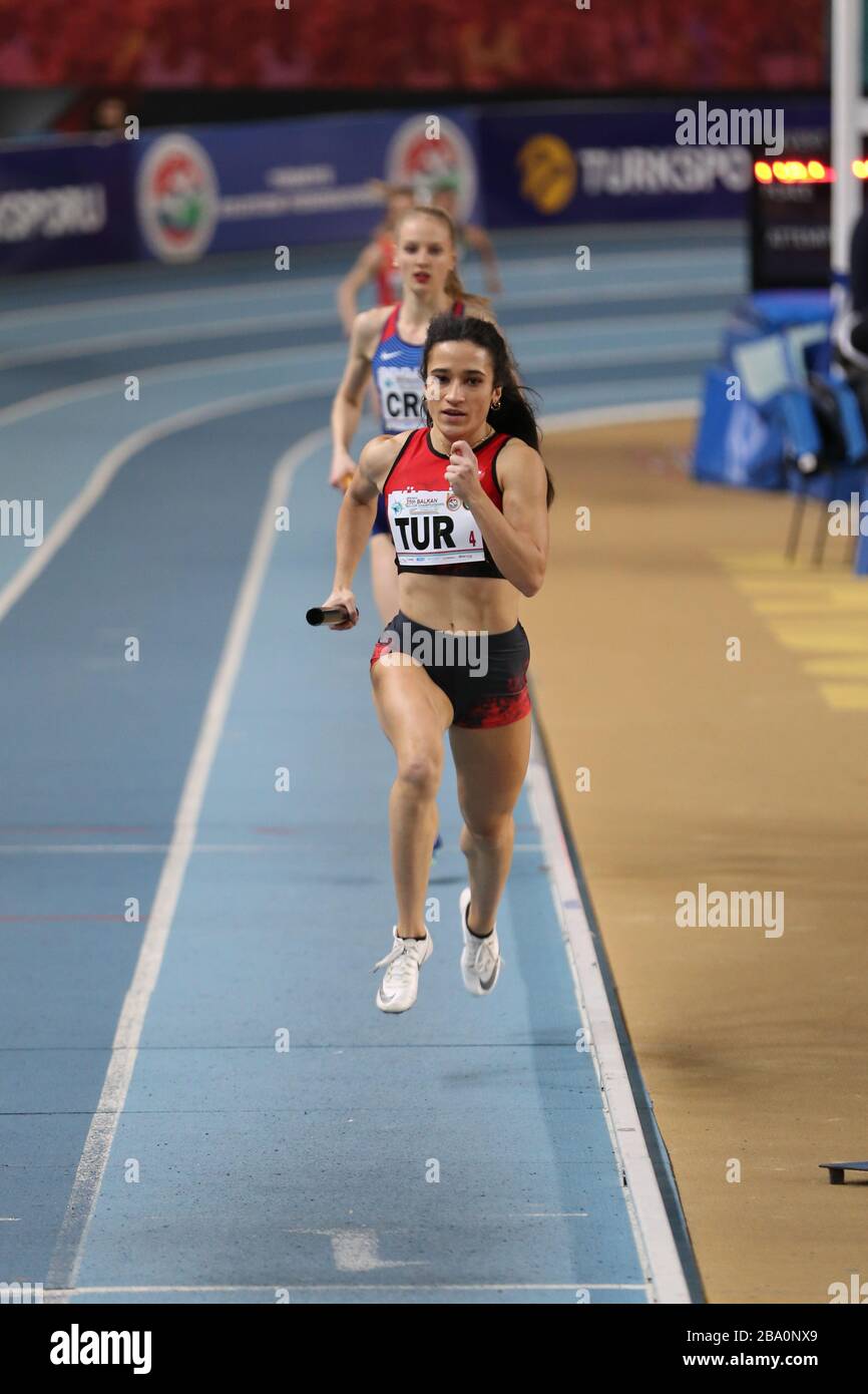 ISTANBUL, TURKEY - FEBRUARY 15, 2020: Athletes running 4x400 relay race ...