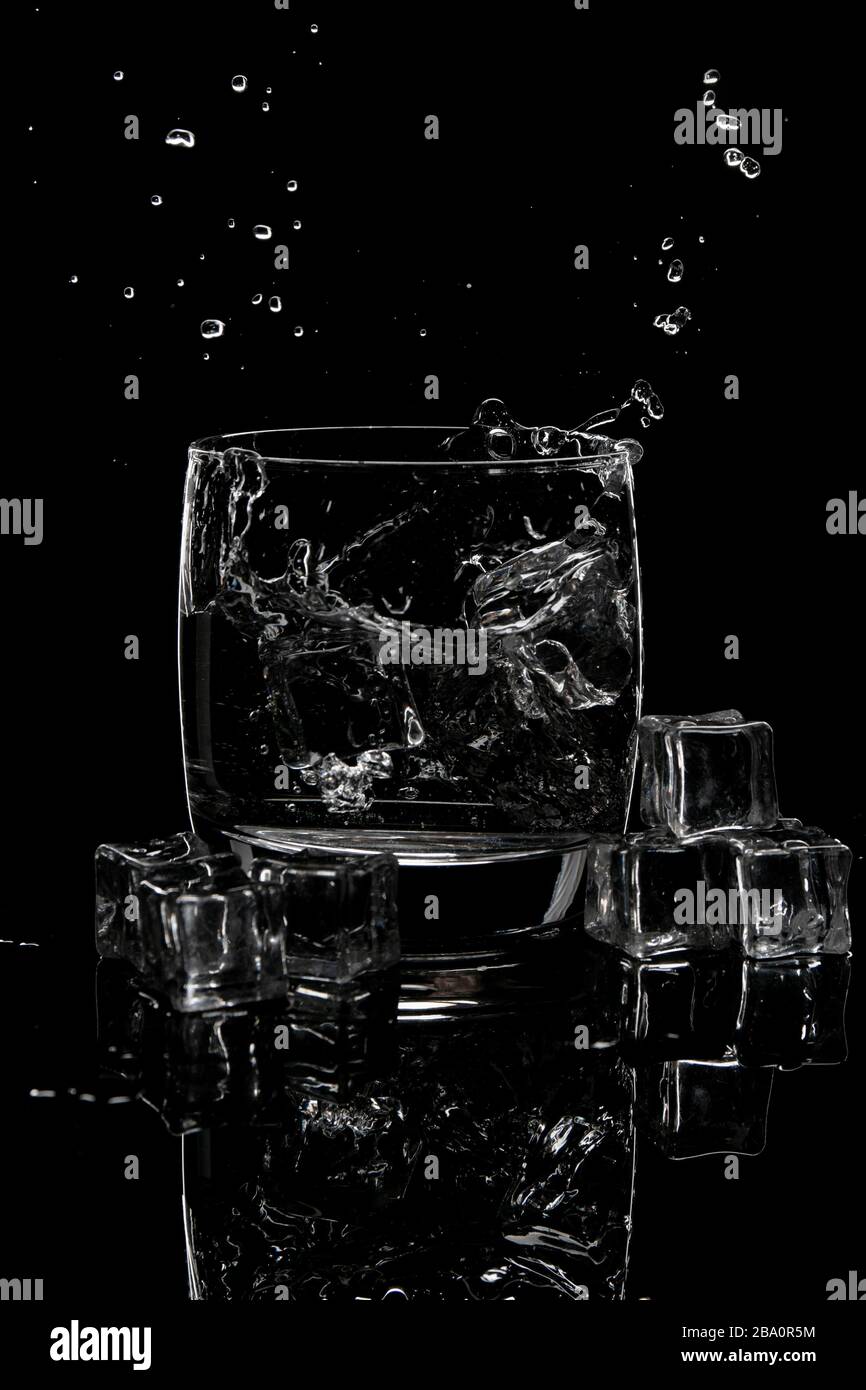 Ice drop with water splash hi-res stock photography and images - Alamy