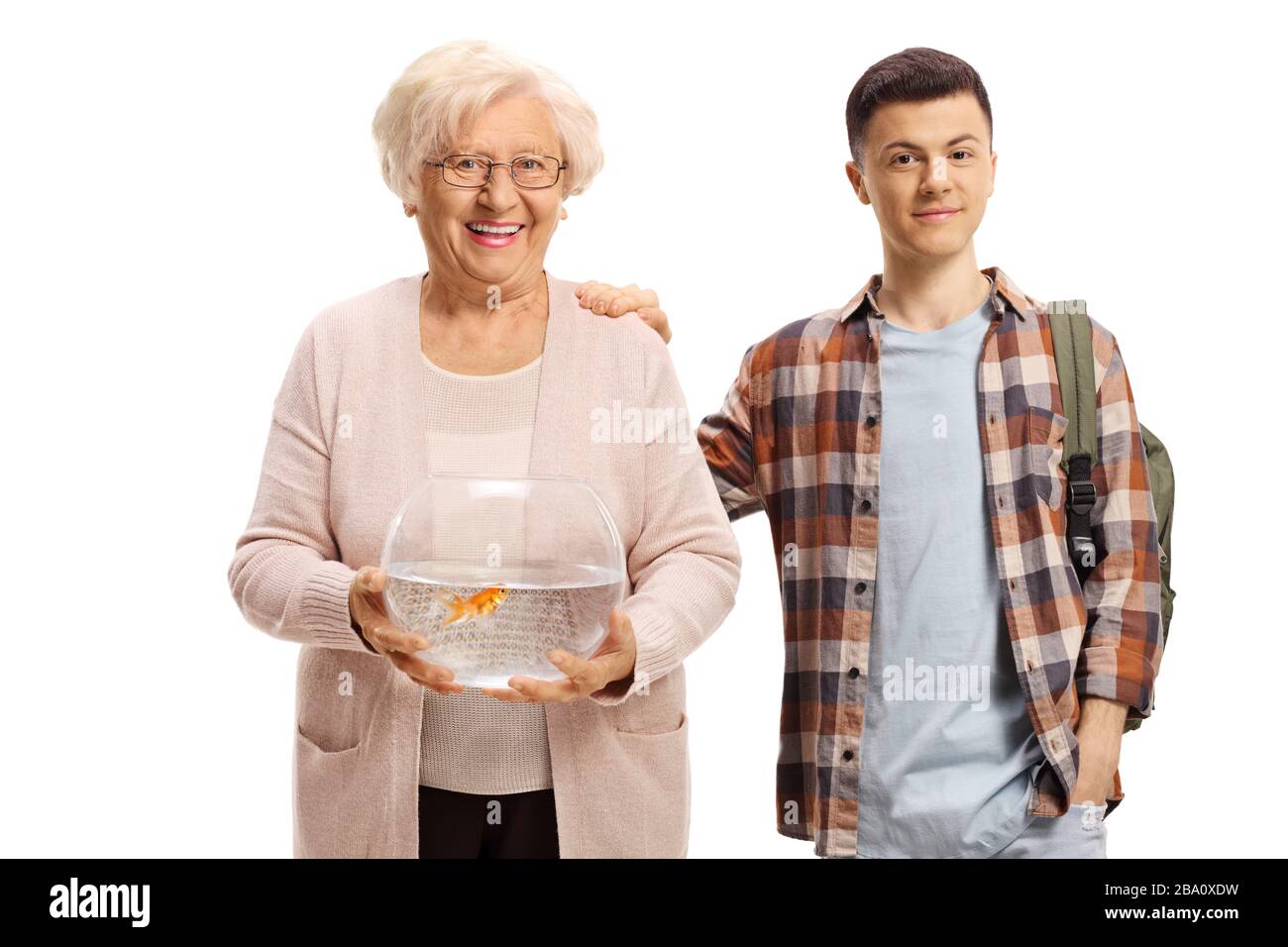 Senior woman holding a bowl with a goldfish and standing next to a male ...