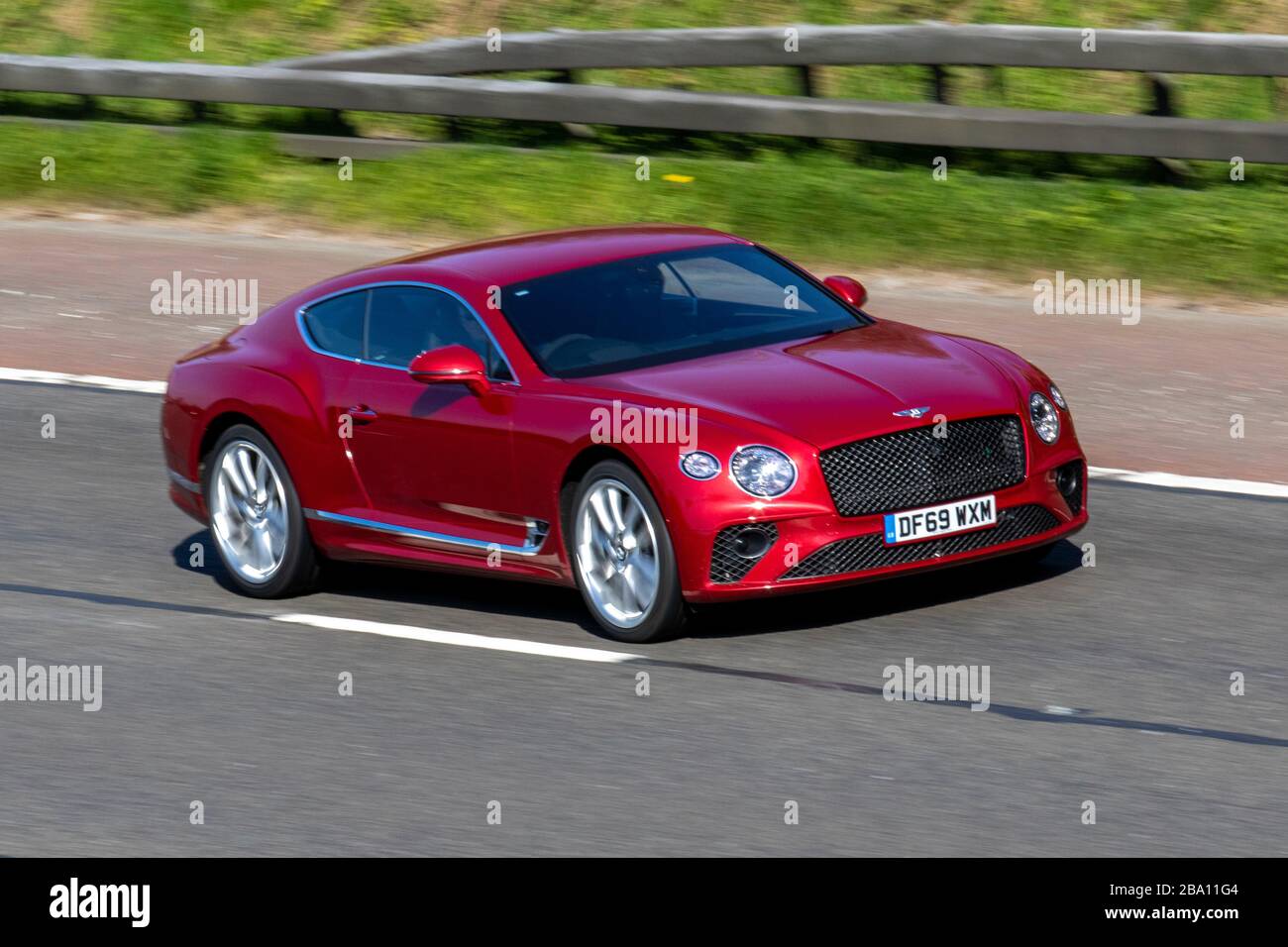 2020 (69) red 2dr Bentley saloon; moving vehicles, vehicle driving ...