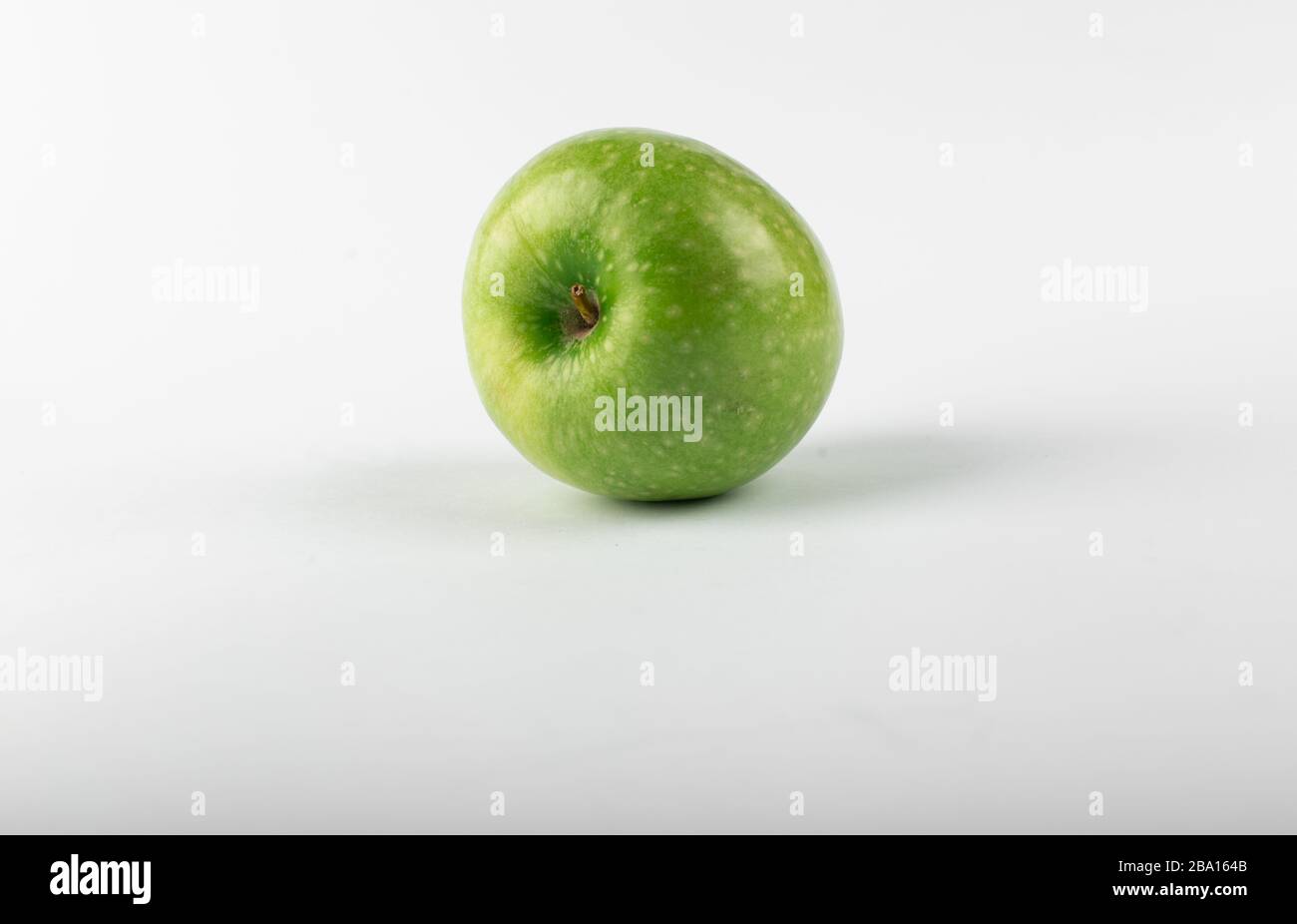 A single green fresh apple isolated on white background. front view ...