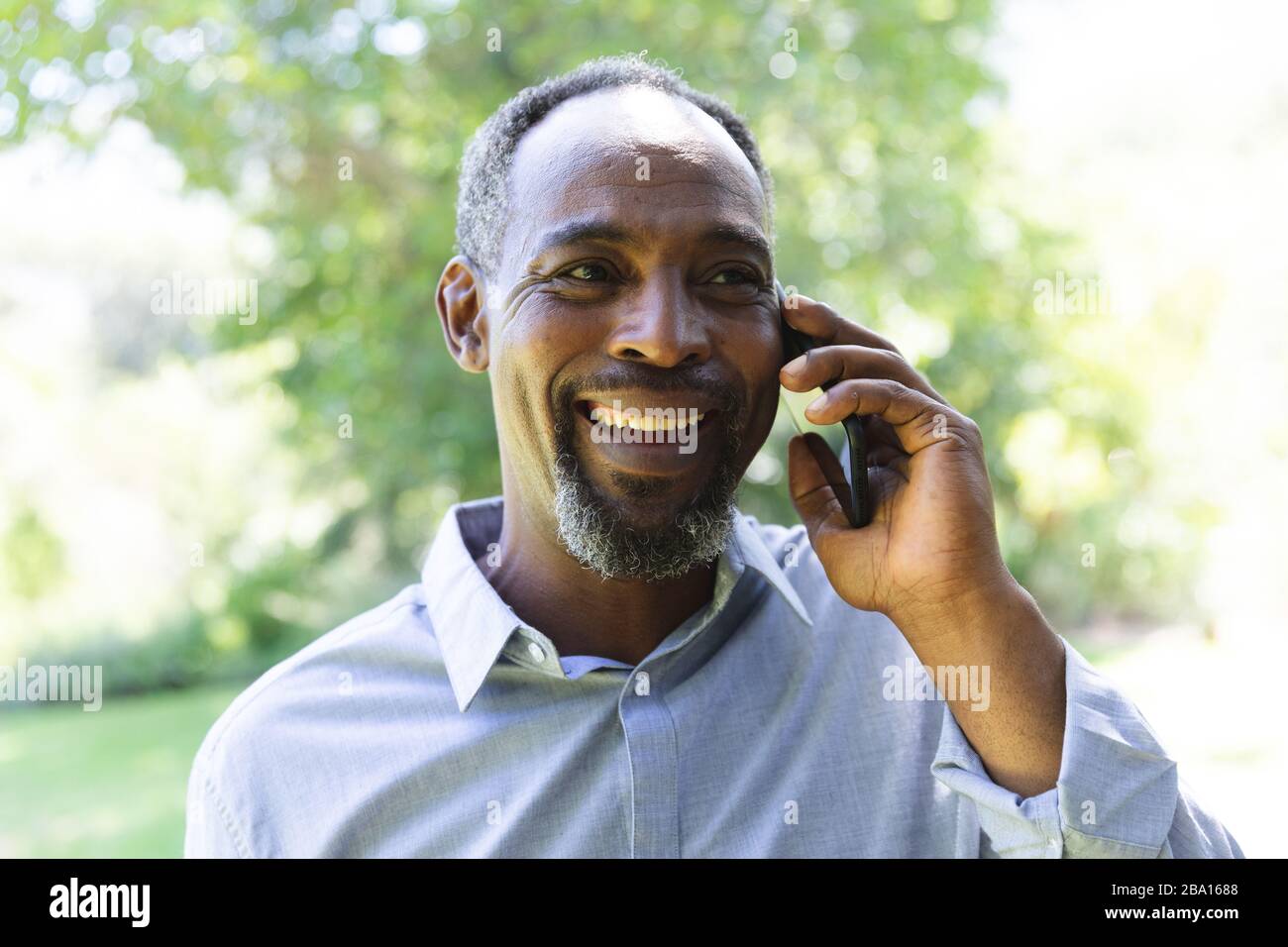 Front view of a senior African American man having a phone call in a ...