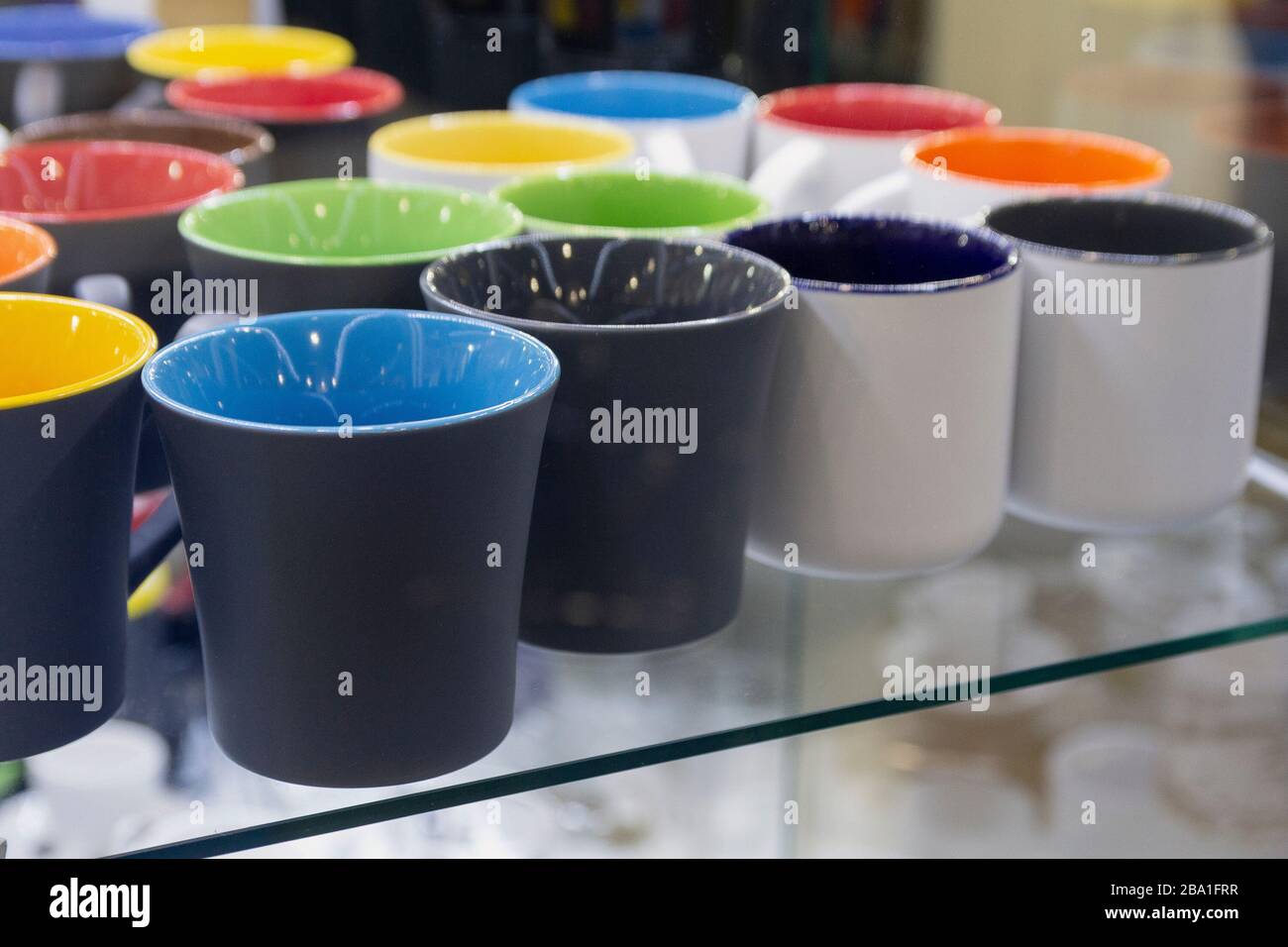 Varied mugs on the counter of the store. Sales Stock Photo - Alamy