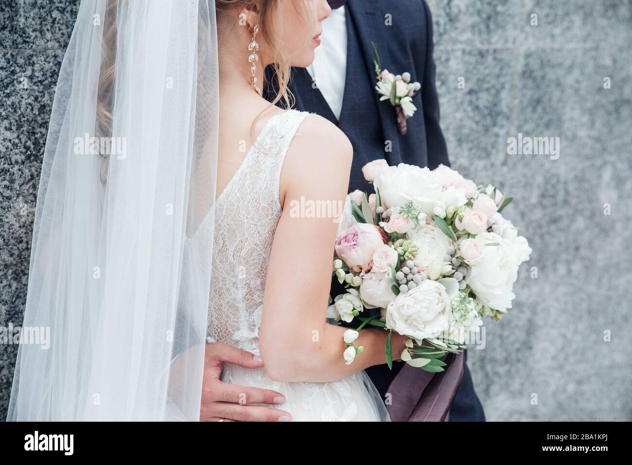 Happy bride and groom on their wedding hugging Stock Photo - Alamy