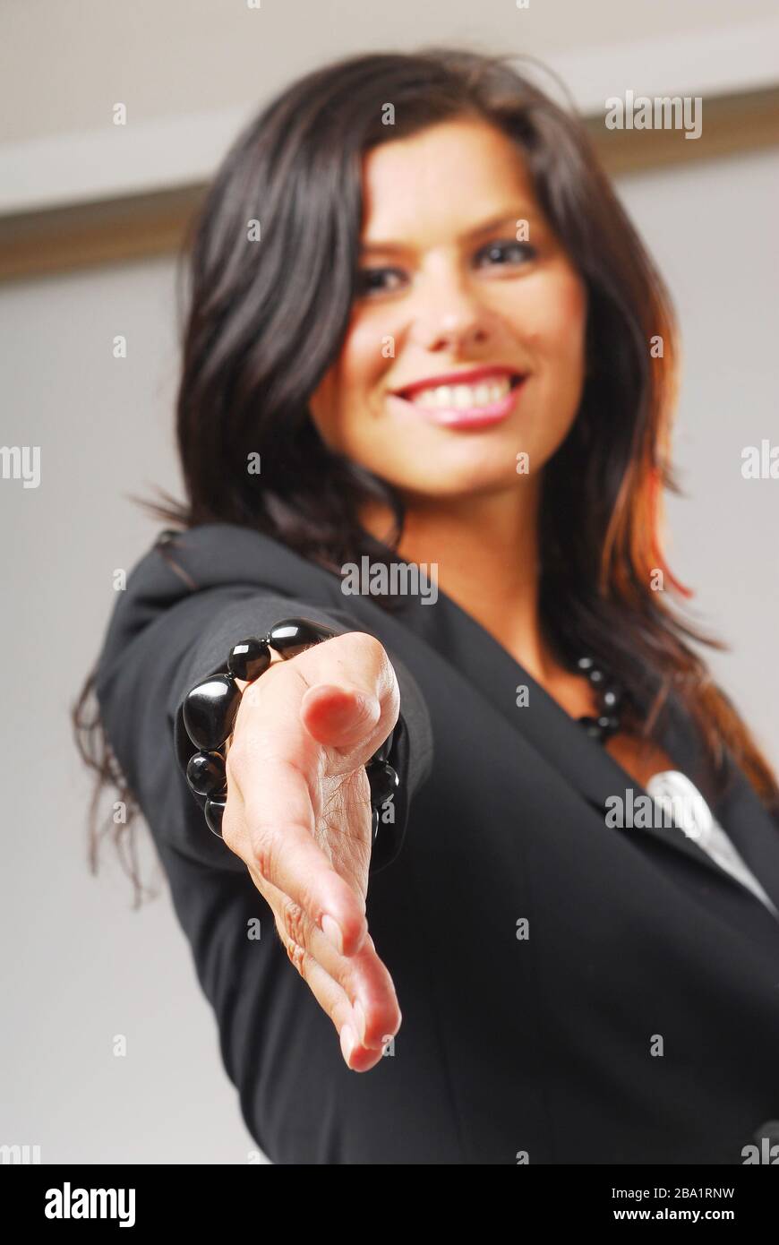 An young woman offering her hand Stock Photo - Alamy