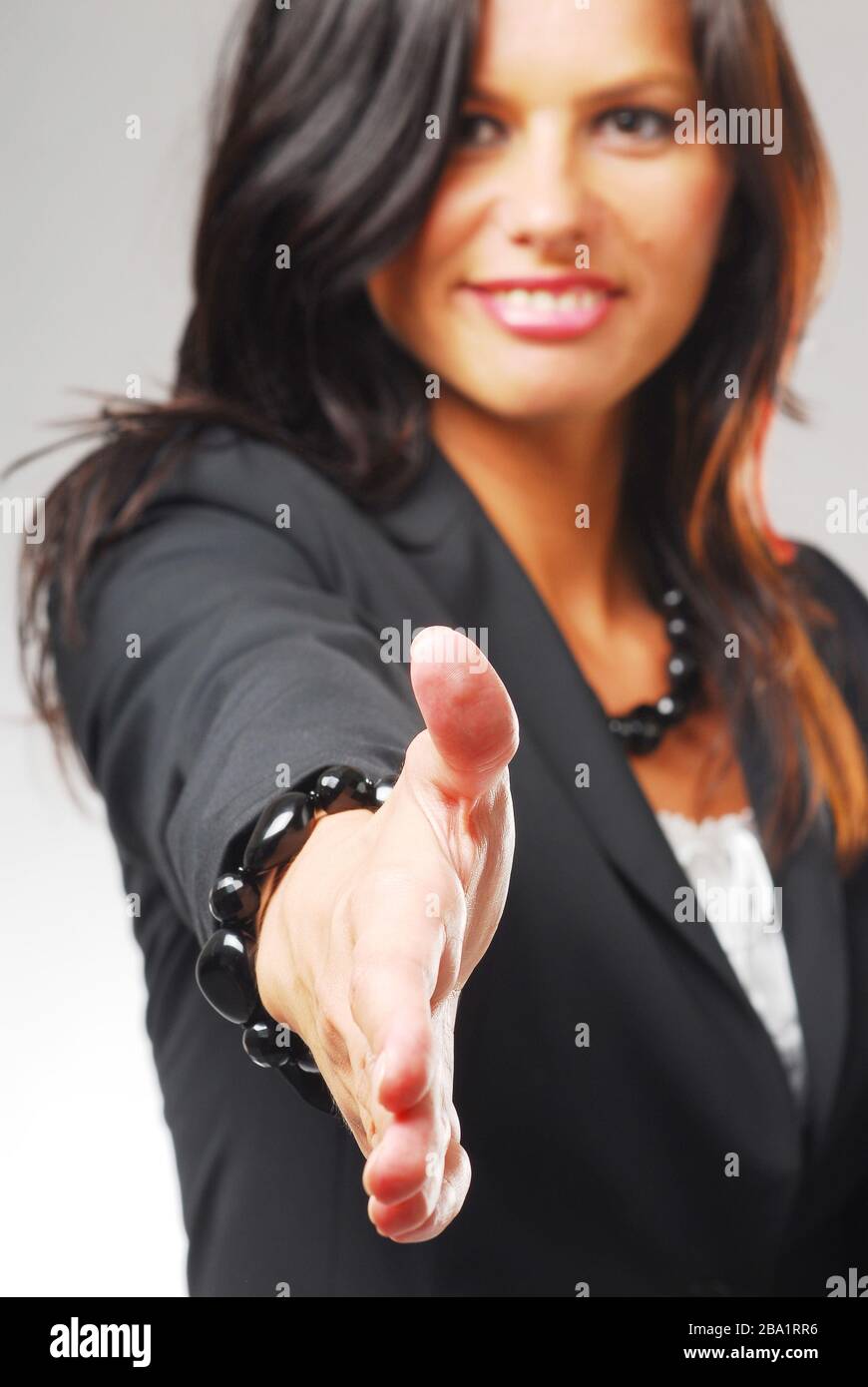 An young woman offering her hand Stock Photo - Alamy