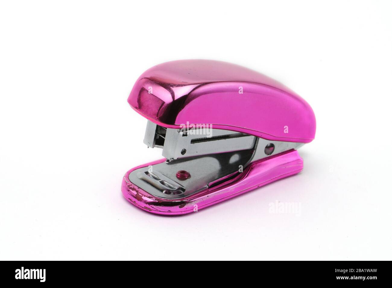 Pink office stapler on an isolated white background Stock Photo - Alamy