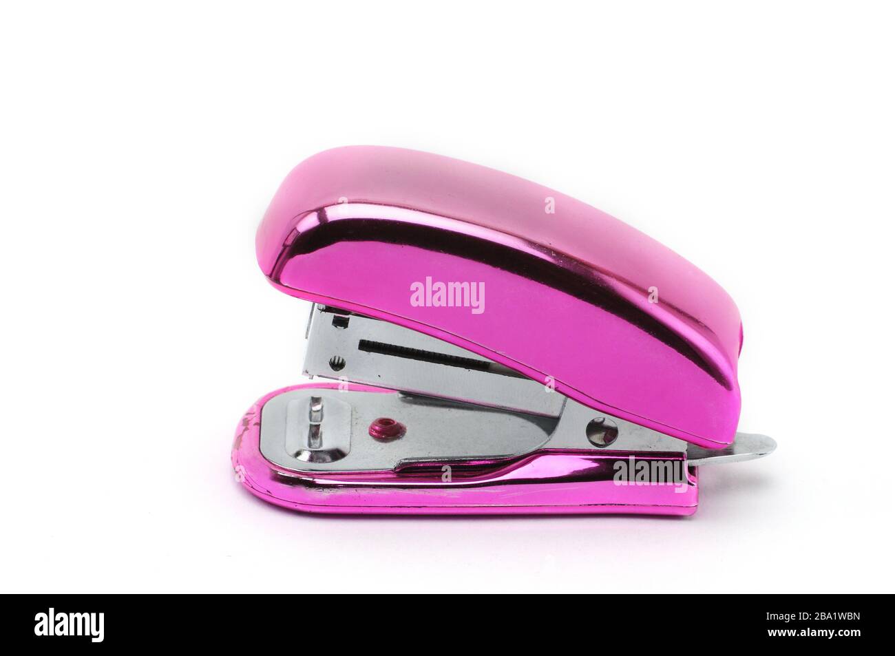 Pink office stapler on an isolated white background Stock Photo - Alamy