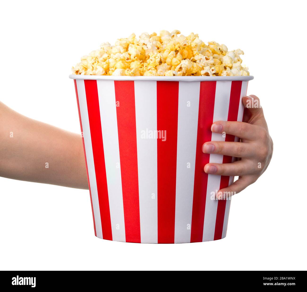 Woman hand holding striped bucket with popcorn isolated on white ...