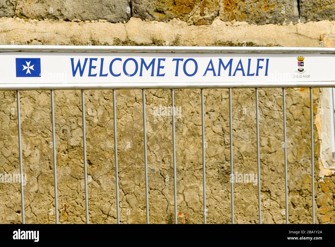 AMALFI, ITALY - AUGUST 2019: "Welcome to Amalfi" sign on metal railings ...