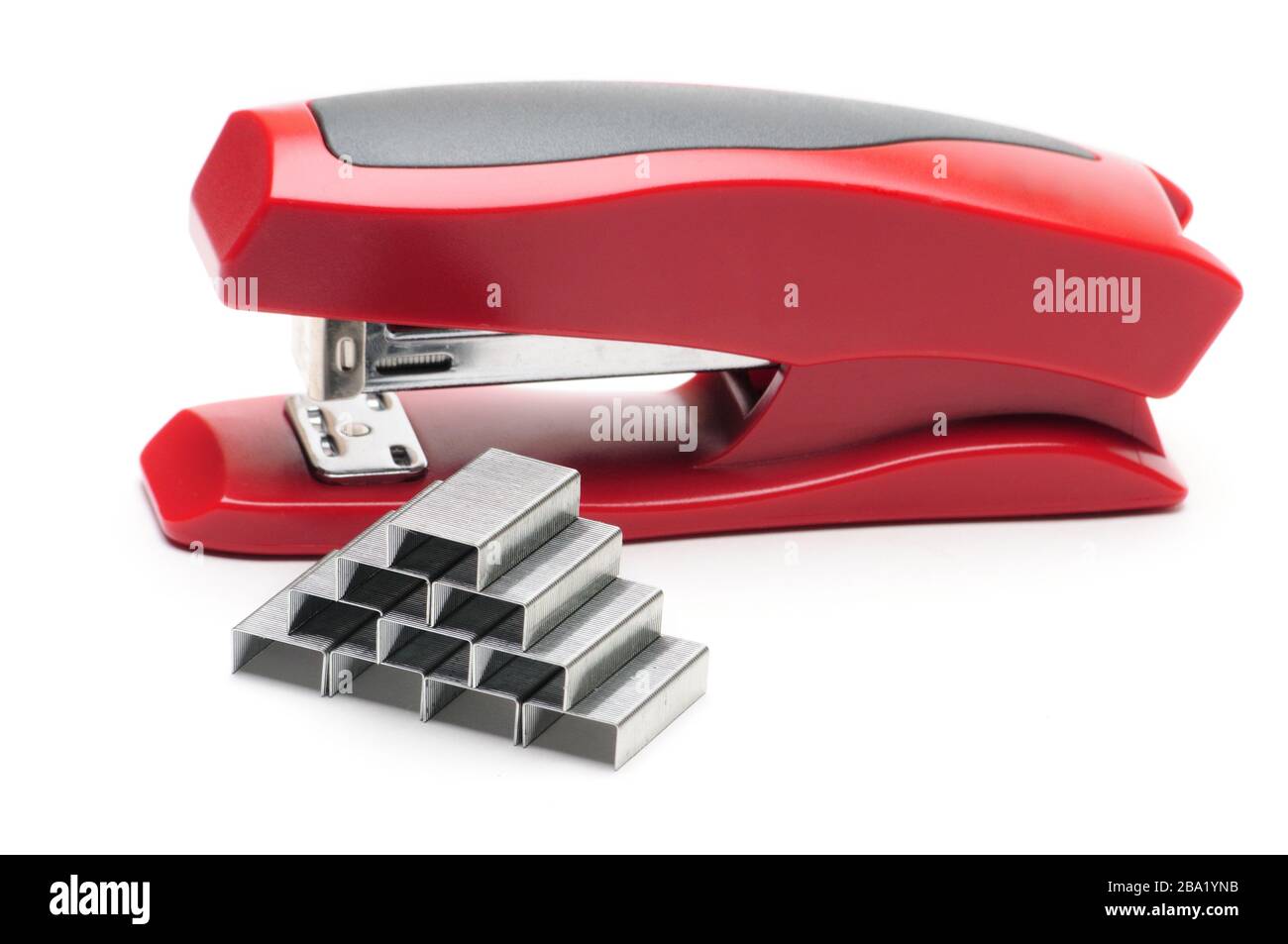 Red office stapler on an isolated white background Stock Photo - Alamy