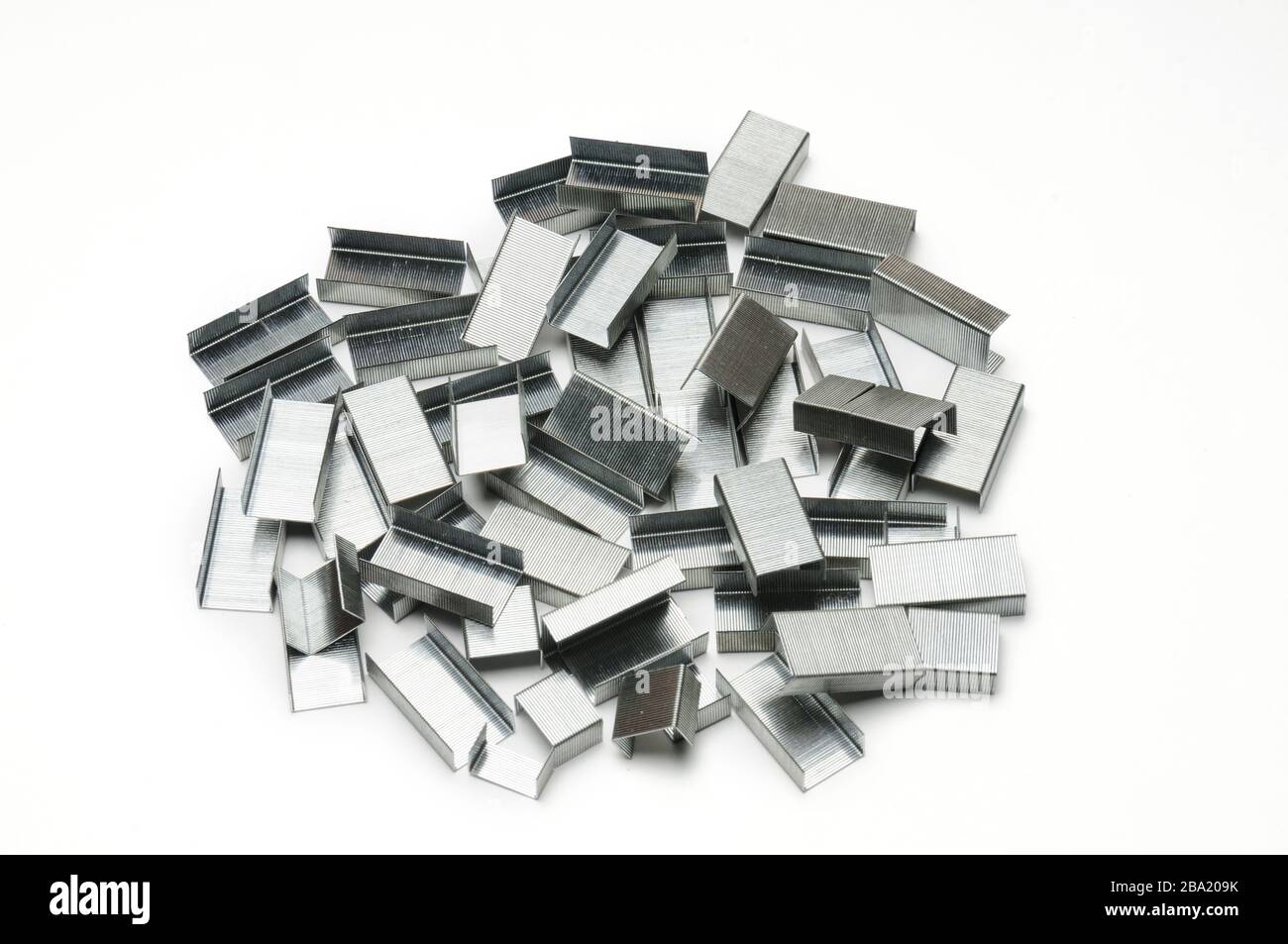 Paper clips from a stapler on an isolated white background Stock Photo ...
