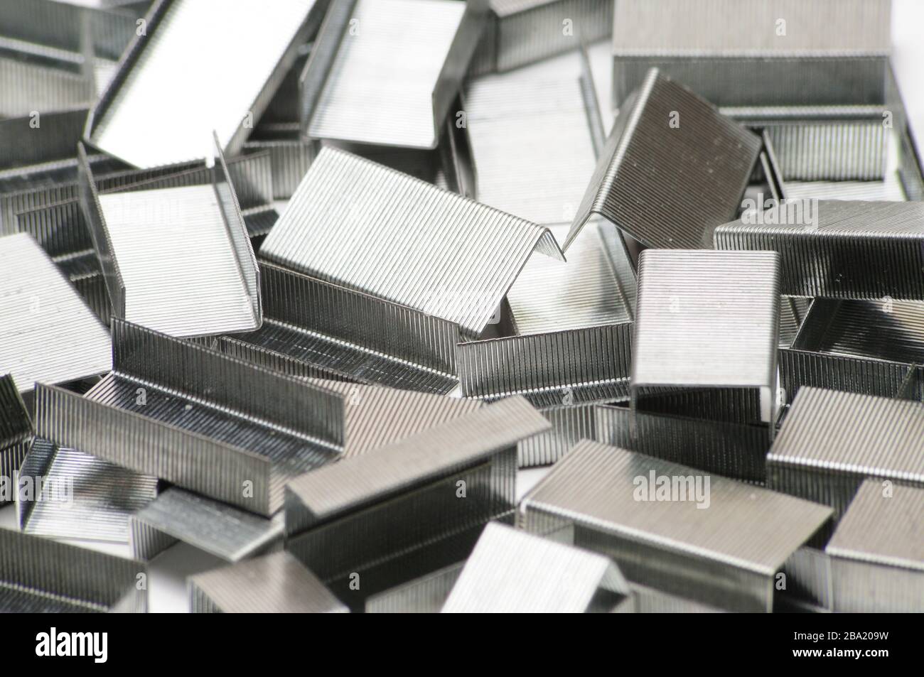 Paper clips from a stapler on an isolated white background Stock Photo ...