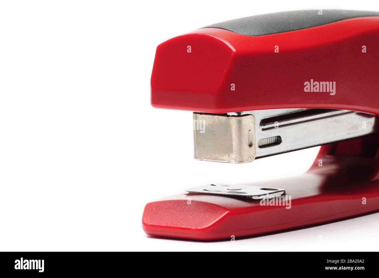 Red office stapler on an isolated white background Stock Photo - Alamy