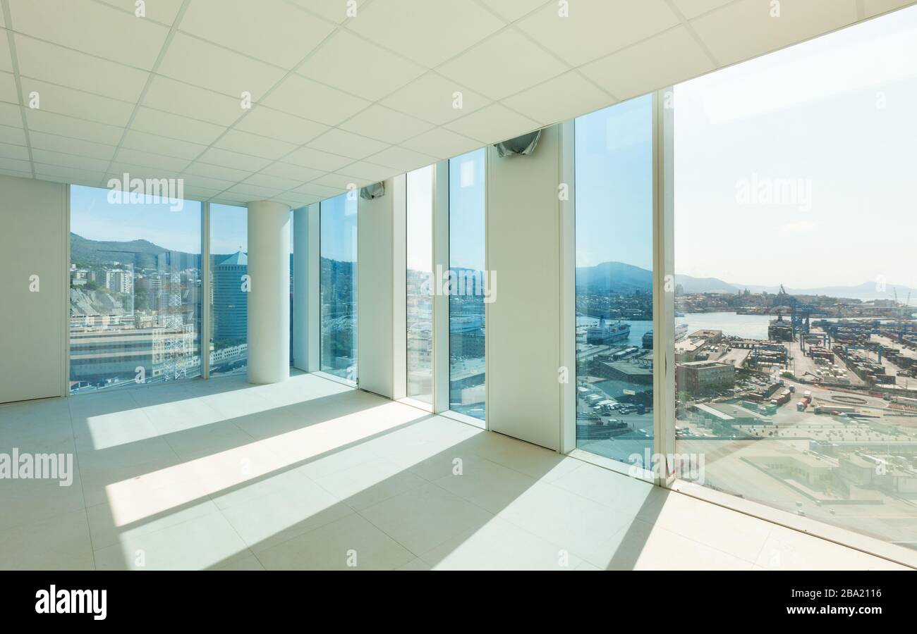 Interior, wide open space, skyscraper, windows overlooking the sea ...
