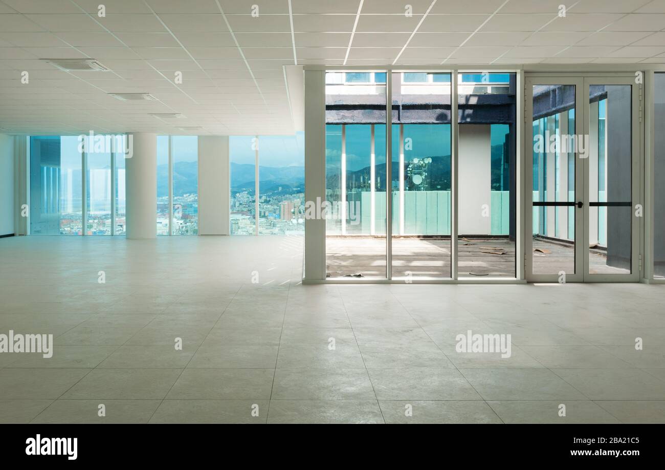 Interior, wide open space, skyscraper, windows overlooking the sea ...
