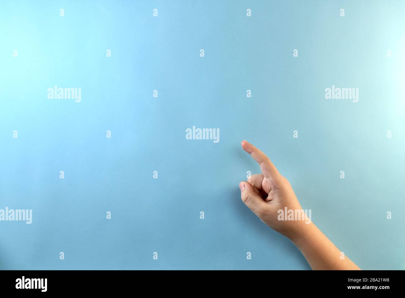 Children's hand side angle with an elongated and raised index finger on ...