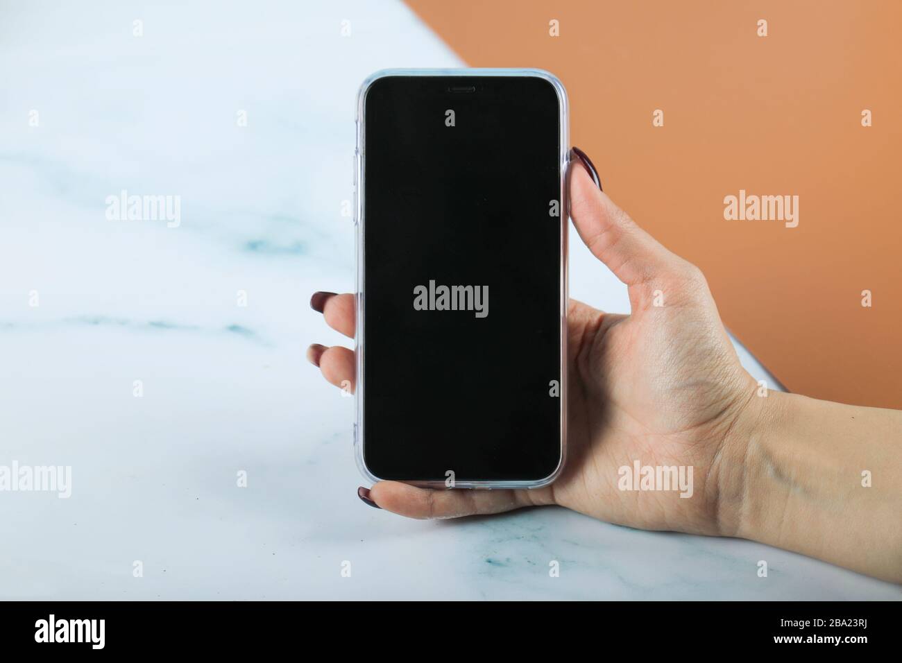Taking a black smartphone in the hand Stock Photo - Alamy