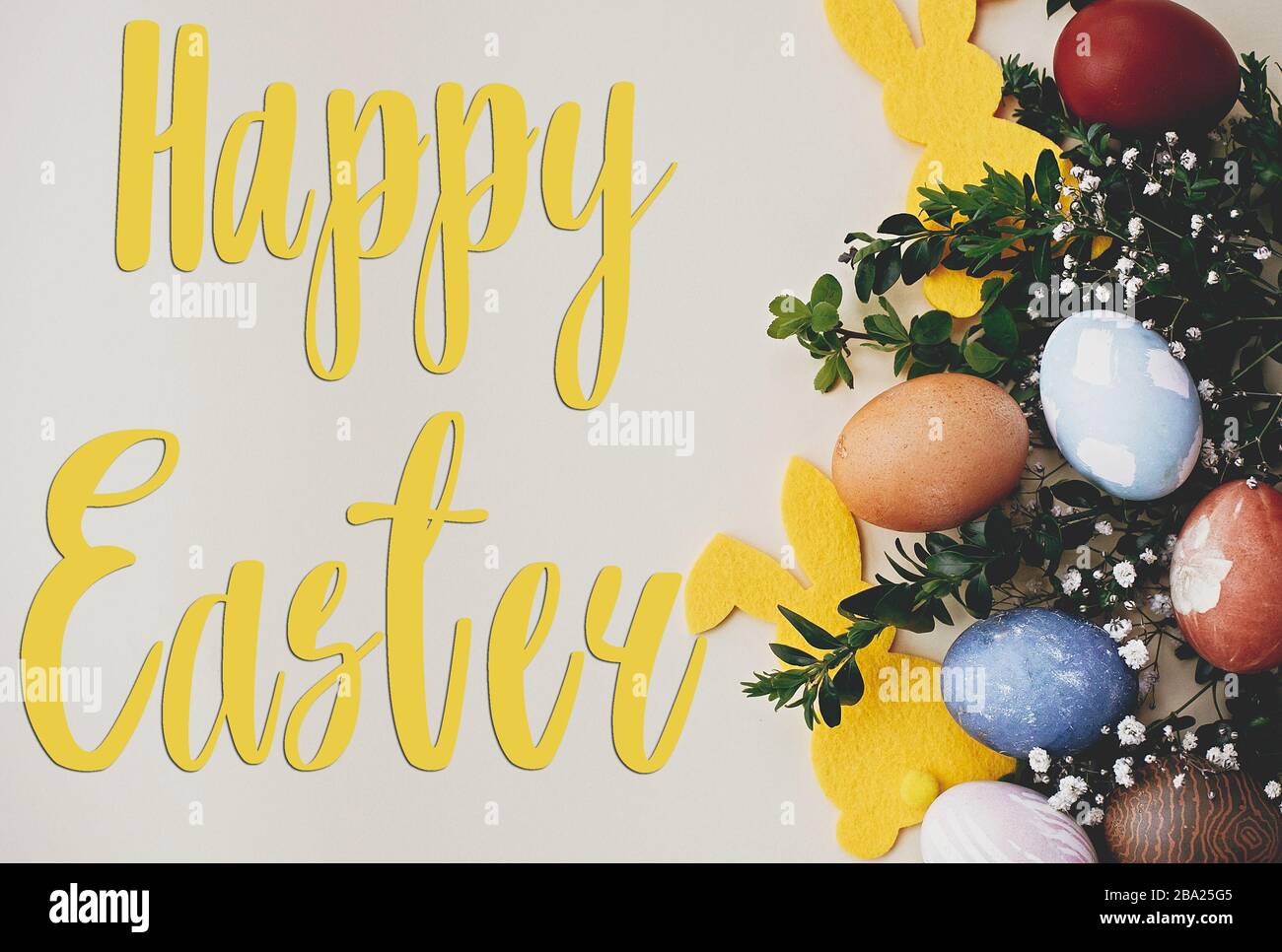 Happy Easter text. Easter greetings card. Stylish easter eggs, yellow ...