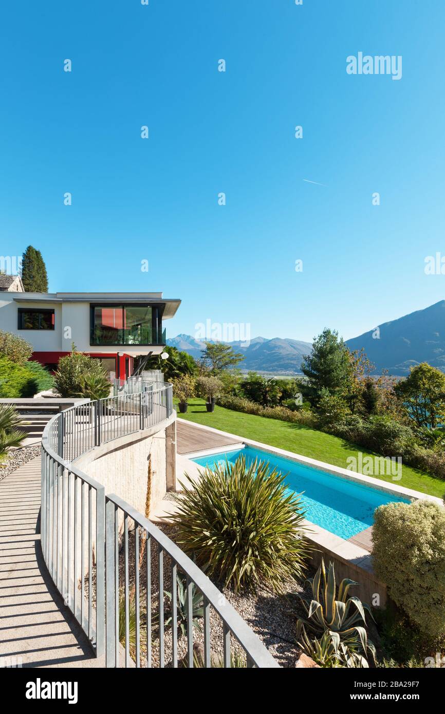 Modern villa with pool, view from the passage Stock Photo - Alamy