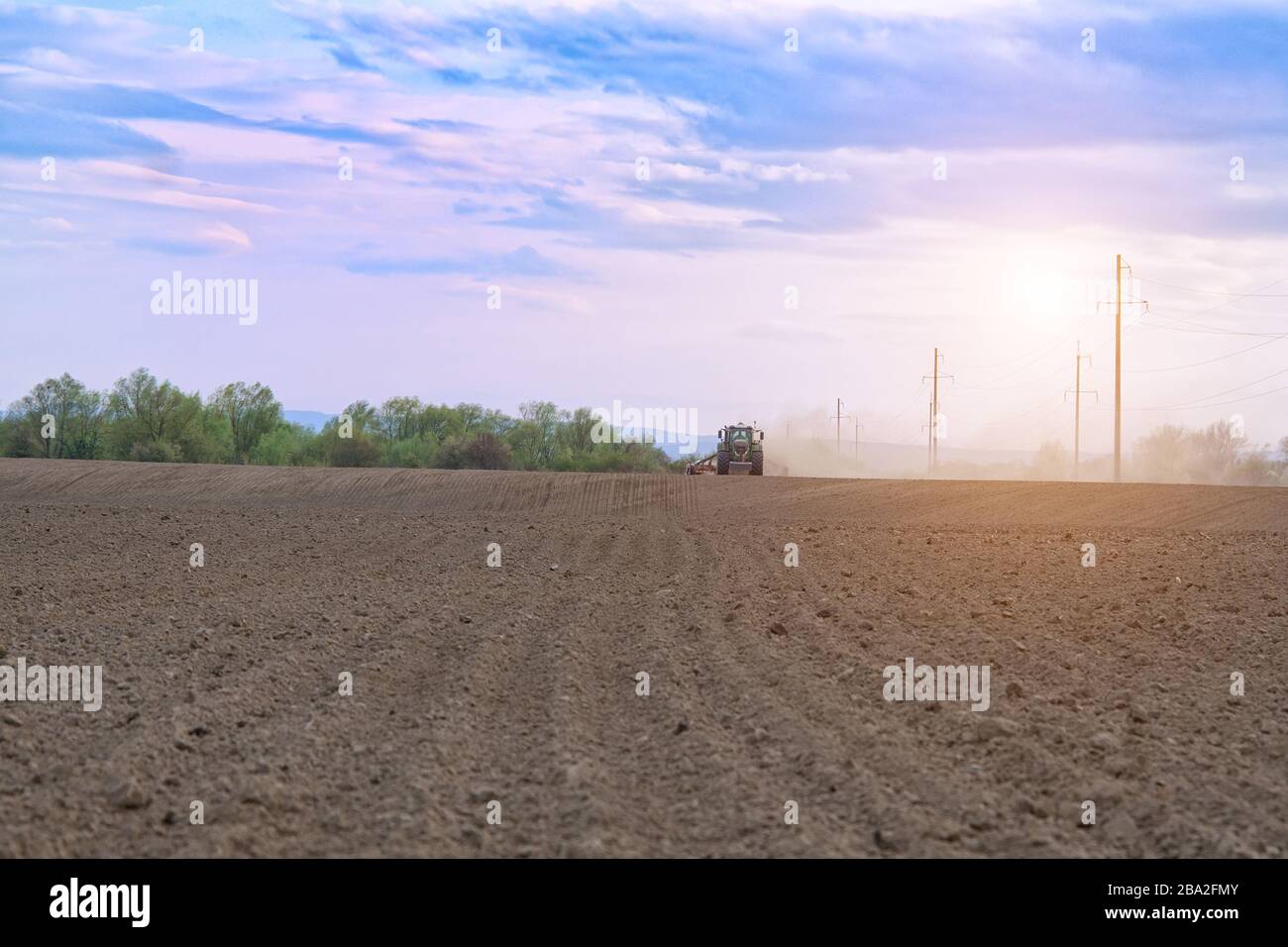 Farmer seeding, sowing crops at field. Sowing is the process of ...