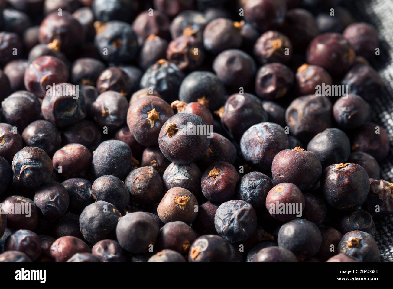 Raw Purple Organic Juniper Berries in a Bowl Stock Photo - Alamy
