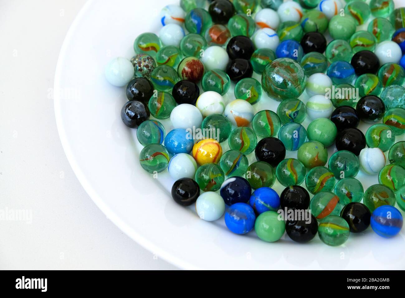 Colored glass balls on 360 degree rotating stand Stock Photo - Alamy