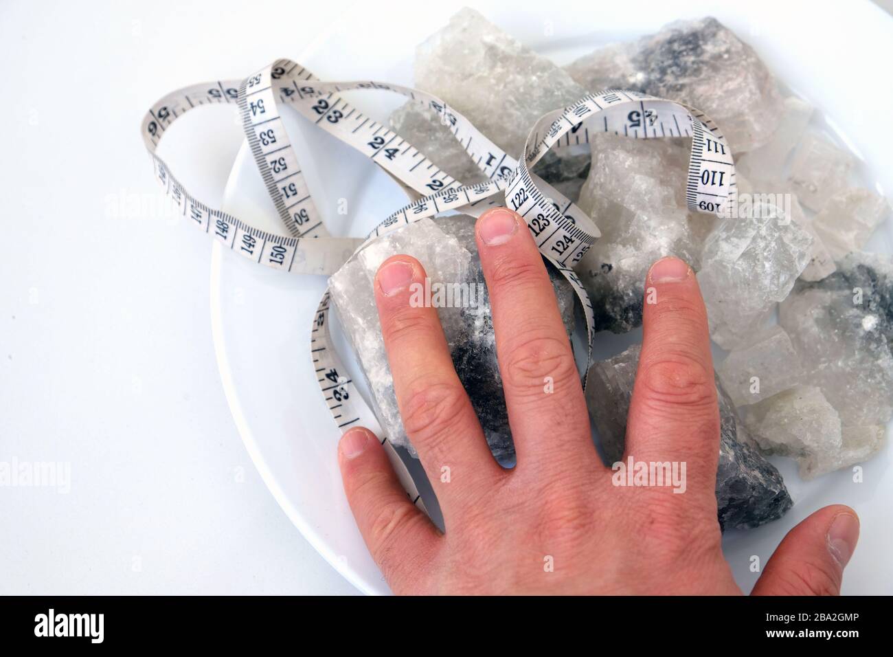 salt and weight gain, the harm of salt for man Stock Photo - Alamy