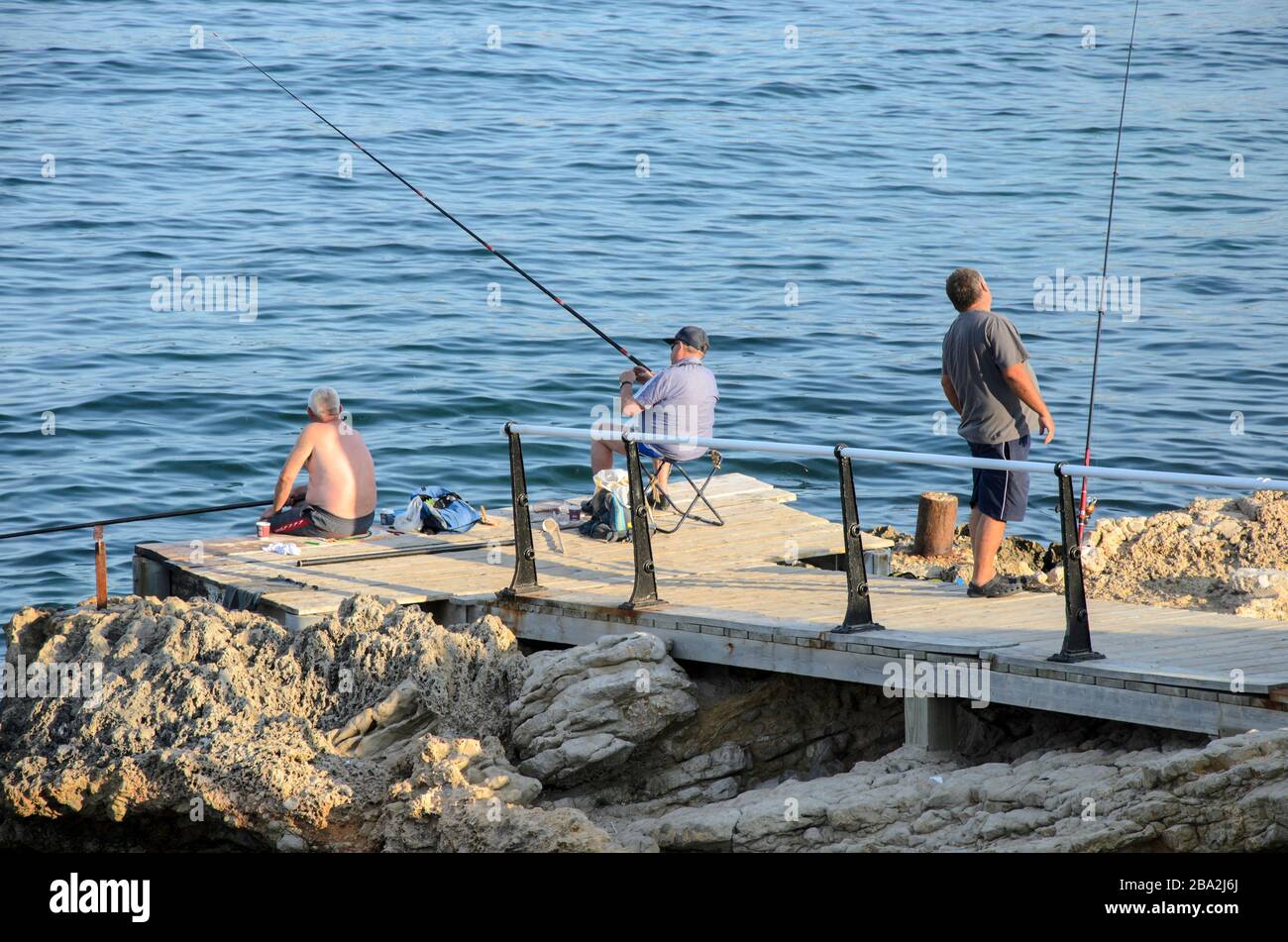 Three men catch hi-res stock photography and images - Alamy