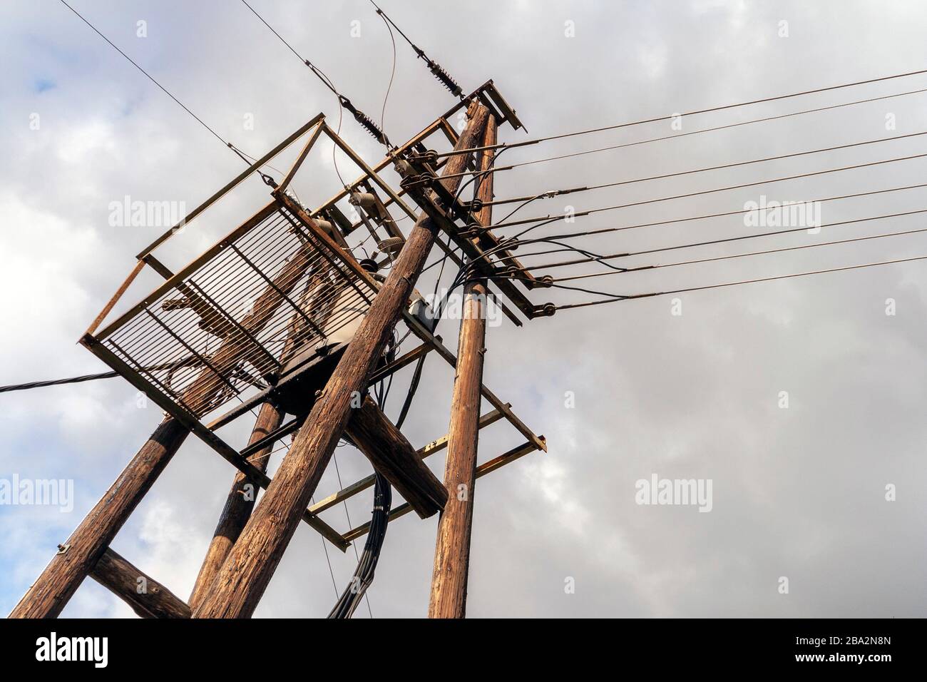 Old power lines on a wooden pole in Europe Stock Photo - Alamy