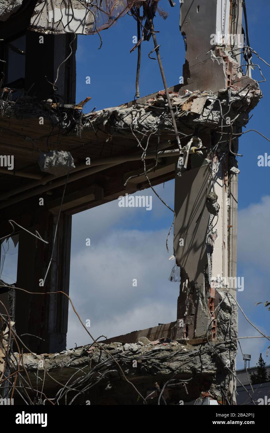 Metal rebar, broken walls, hanging wires and bare empty windows frames ...