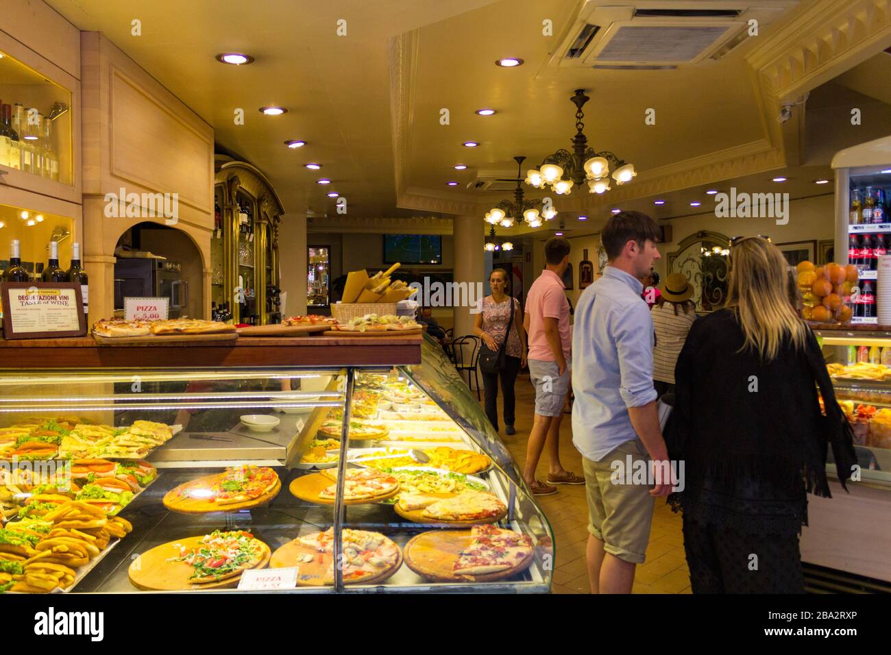 The interior of traditional Italian cafeteria offering typical dishes ...