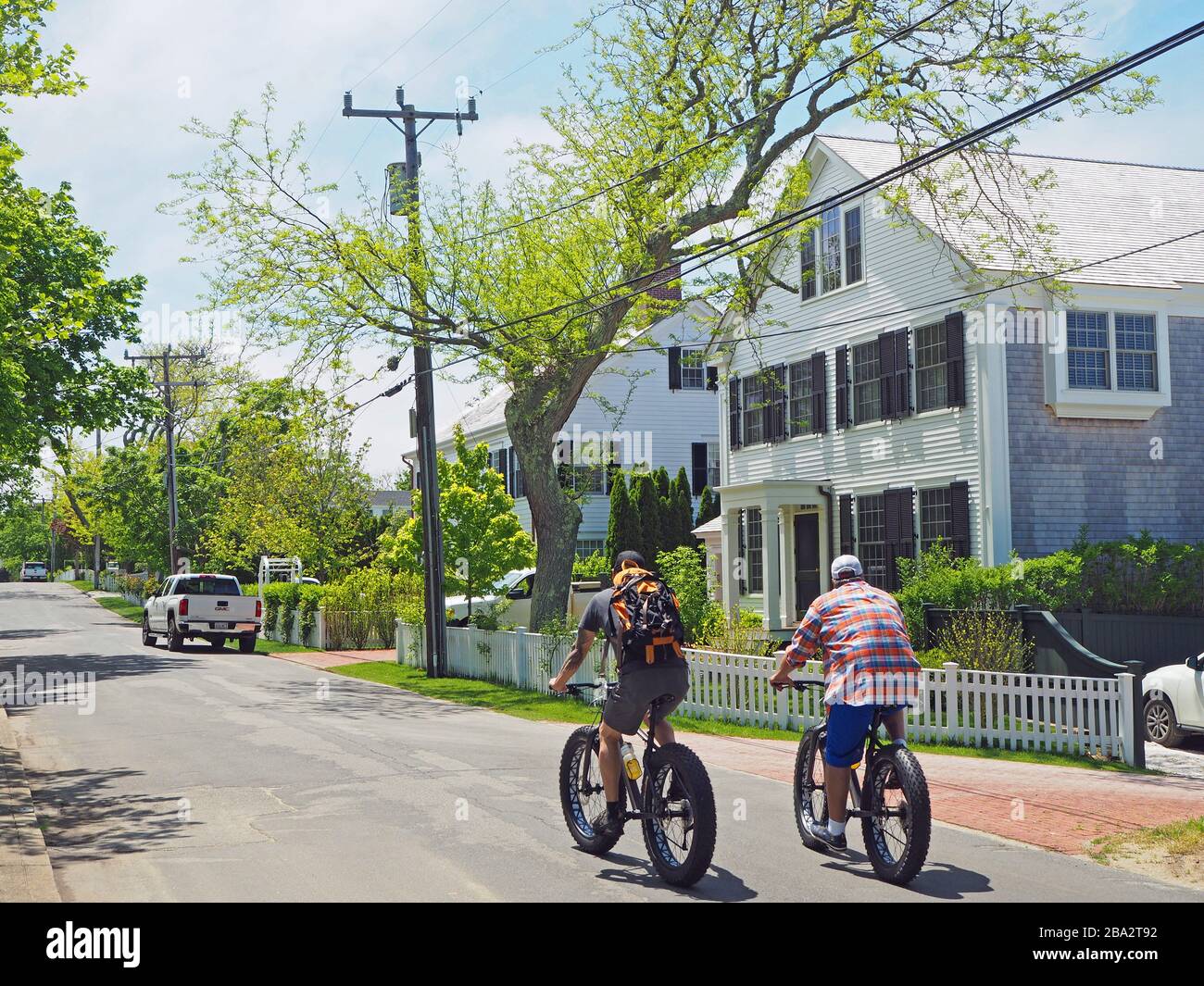 Two men riding bikes, Martha’s Vineyard, Massachusetts, USA Stock Photo ...