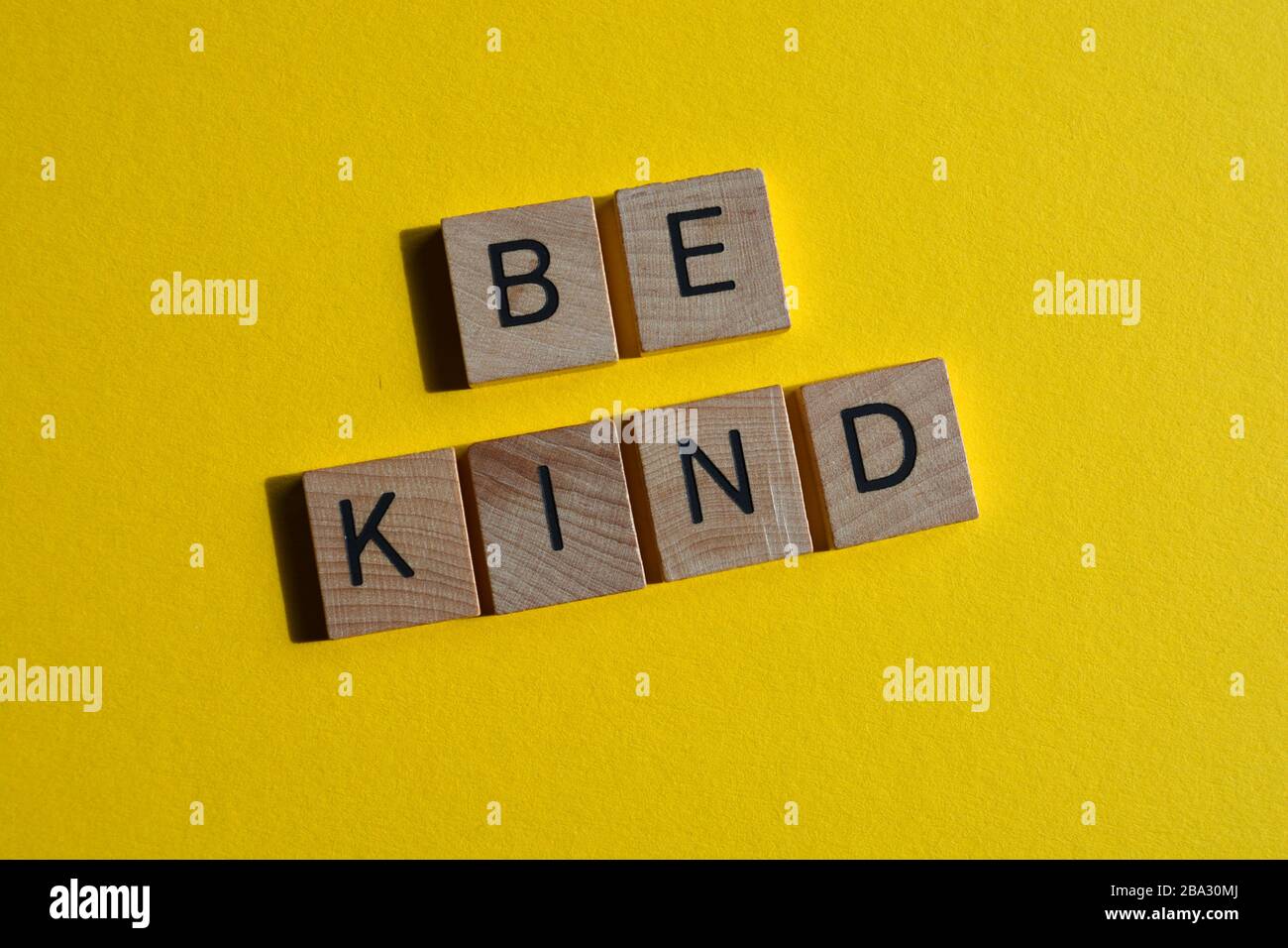 Be Kind, in 3d wooden alphabet letters on yellow background Stock Photo ...