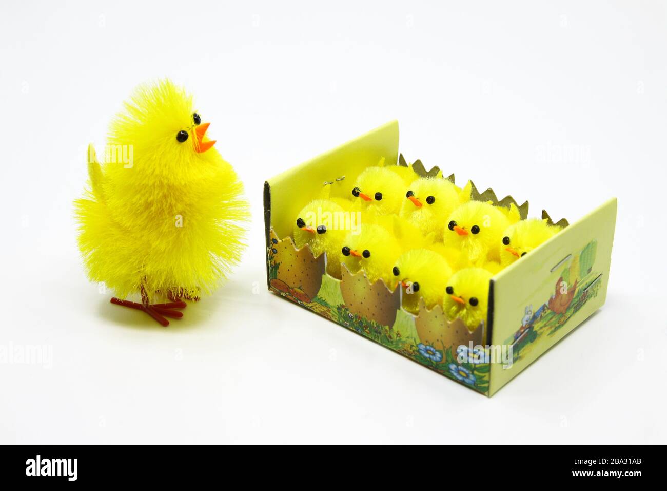 Group of cute Easter chicks in cardboard, paper basket Stock Photo - Alamy